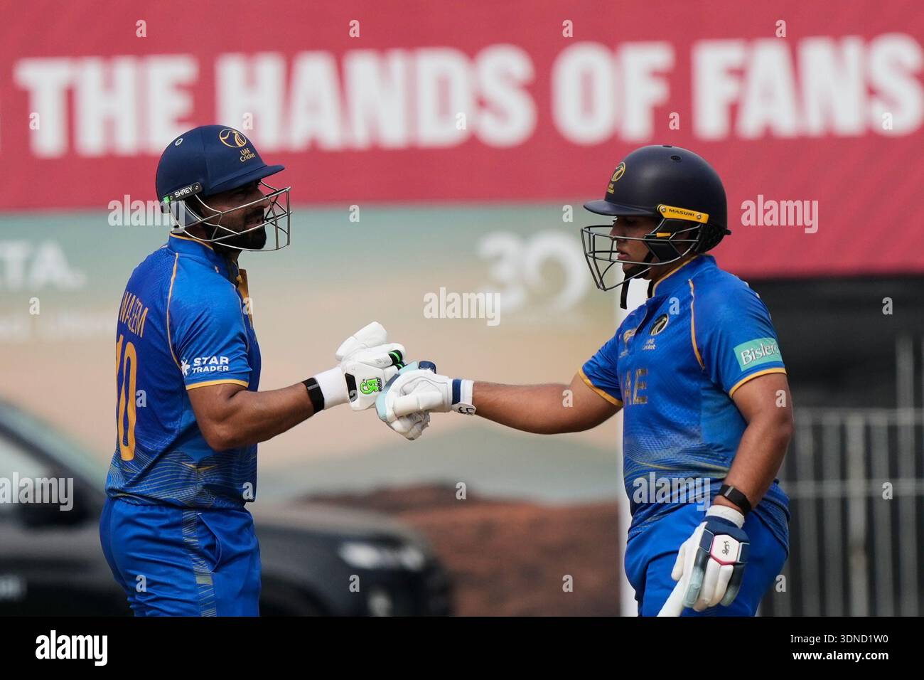 United Arab Emirates' captain Muhammad Waseem, left, and Alishan ...