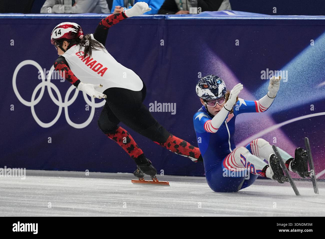 Corinne Stoddard of the United States crashes as Courtney Sarault of ...