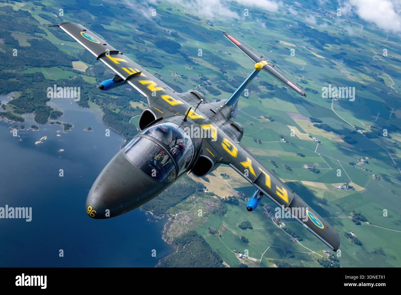 In this overhead air‑to‑air image the Swedish Air Force’s Saab Sk 60A ...