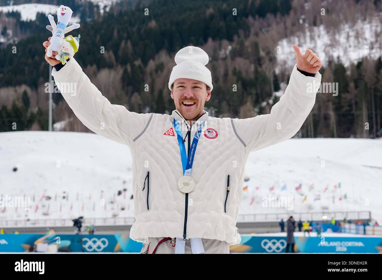 Ben Ogden, of the United States, poses after winning the silver medal ...