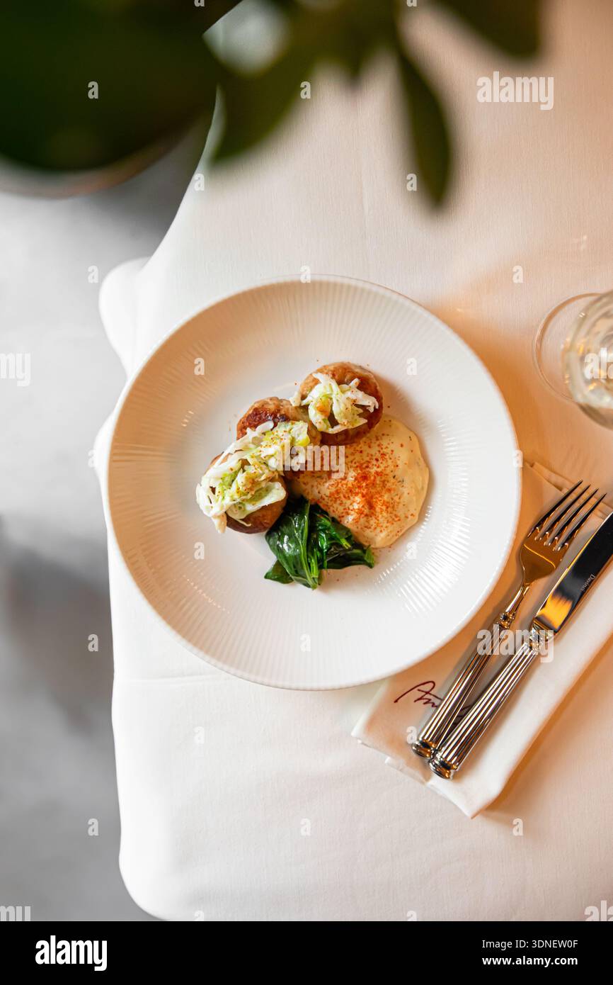 Chicken patties with potato mousse and greens Stock Photo - Alamy