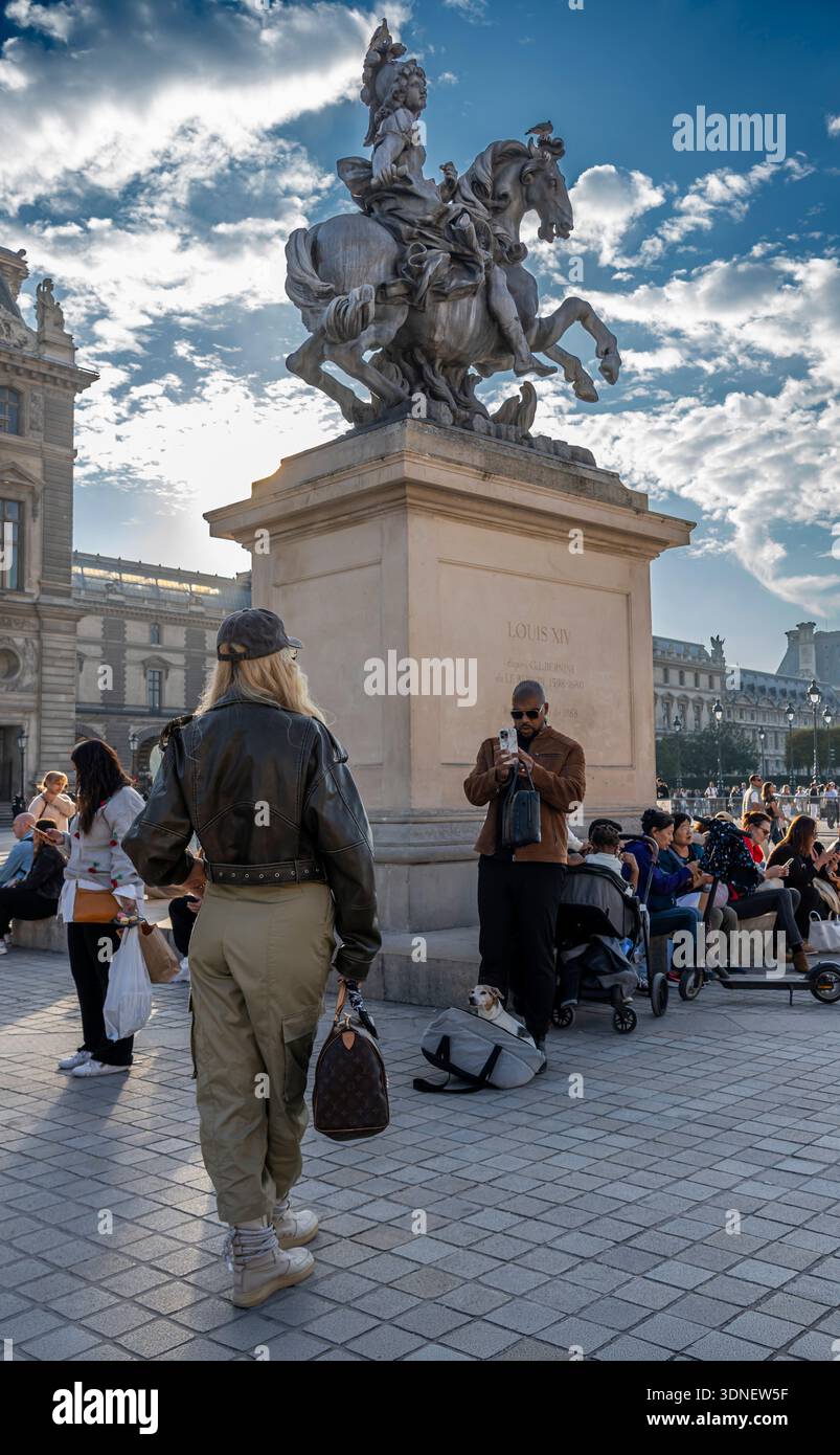Paris, France - 10 11 2025: View of a blonde woman's back being ...