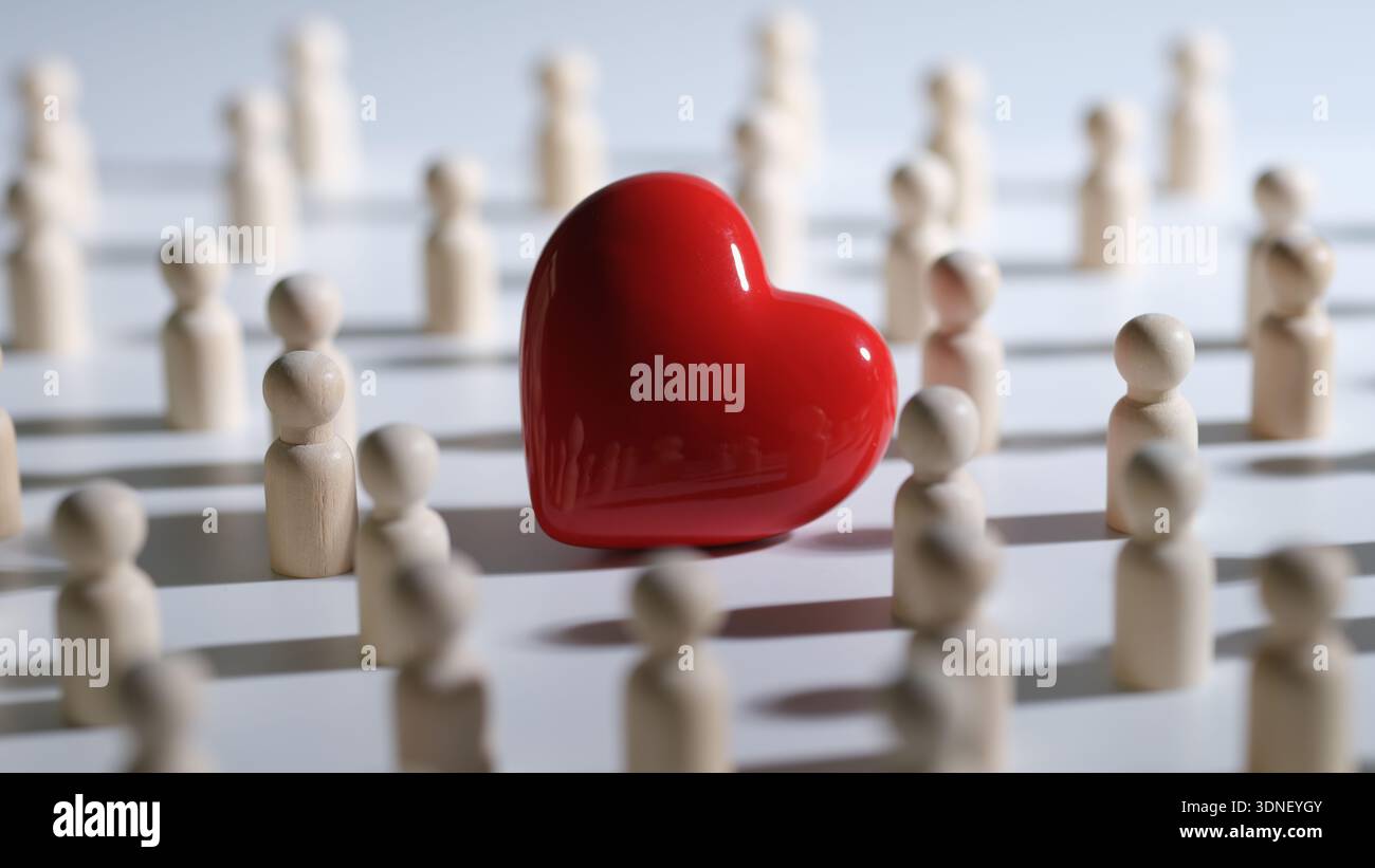 Red heart symbol stands tall among wooden figures representing ...