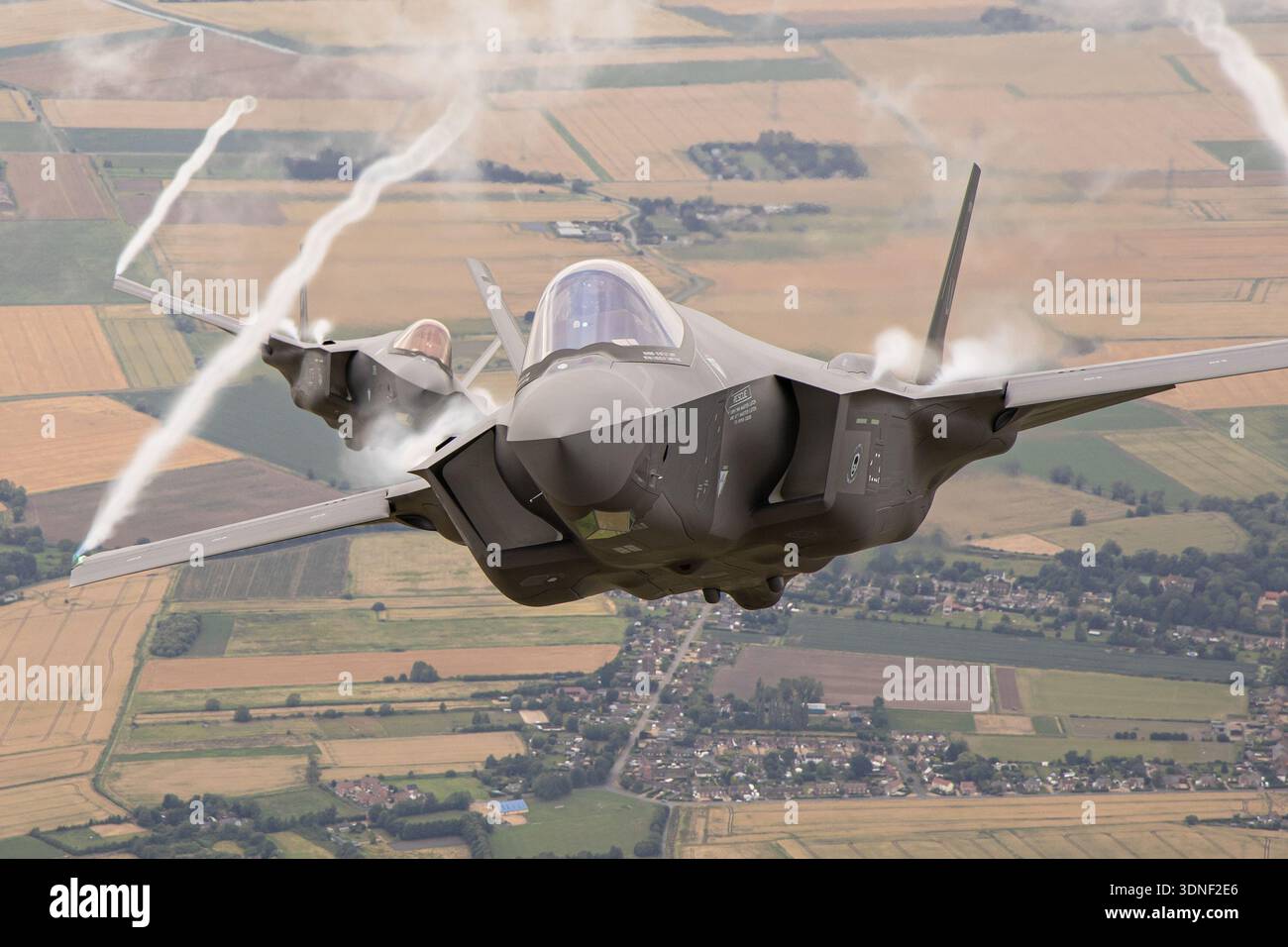 Two U.S. Air Force F-35A Lightning II aircraft are shown flying in ...