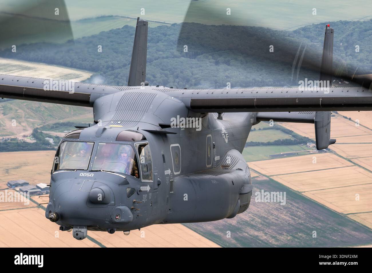 A close-up head-on air-to-air image captures a U.S. Air Force CV-22B ...