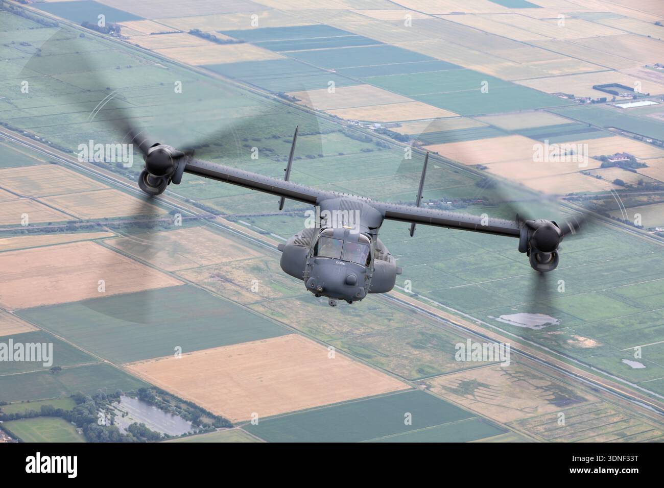 A U.S. Air Force Bell-Boeing CV-22B Osprey tiltrotor aircraft flies ...