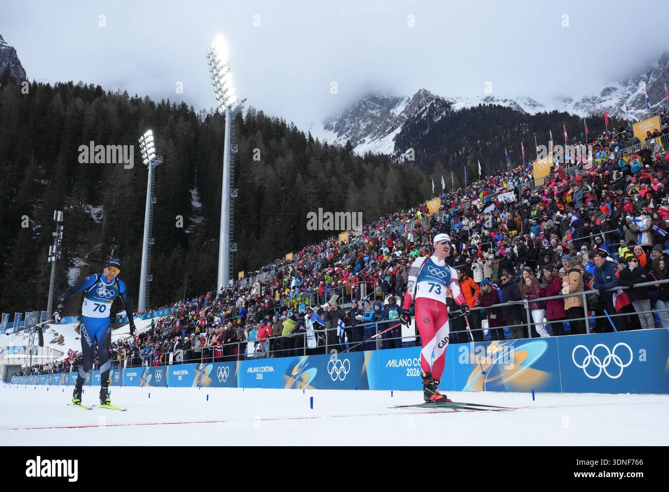 Zachary Connelly, of Canada, right, crosses the finish line near Kristo ...