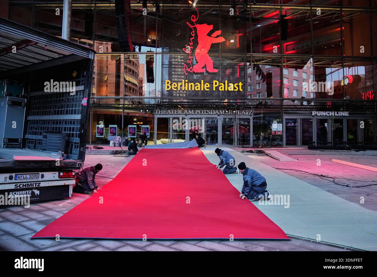 Workers roll out the red carpet ahead of the 76th Berlinale ...