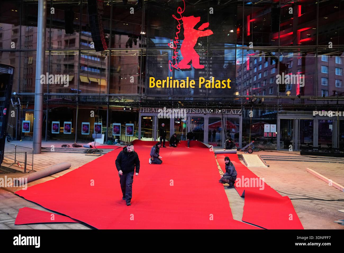 Workers roll out the red carpet ahead of the 76th Berlinale ...