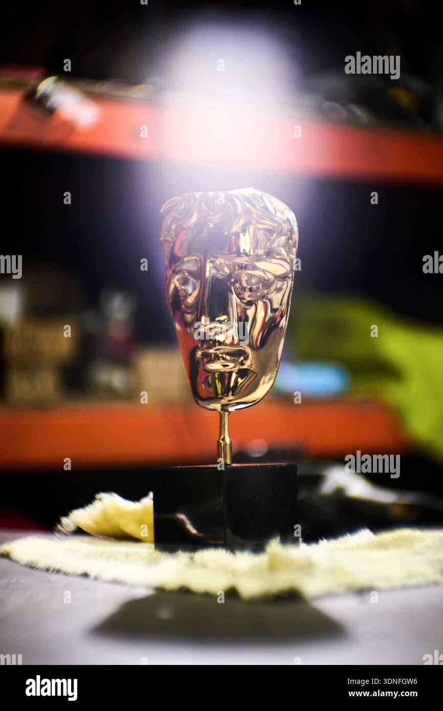 A British Academy Film Awards mask sits on a workbench during the ...