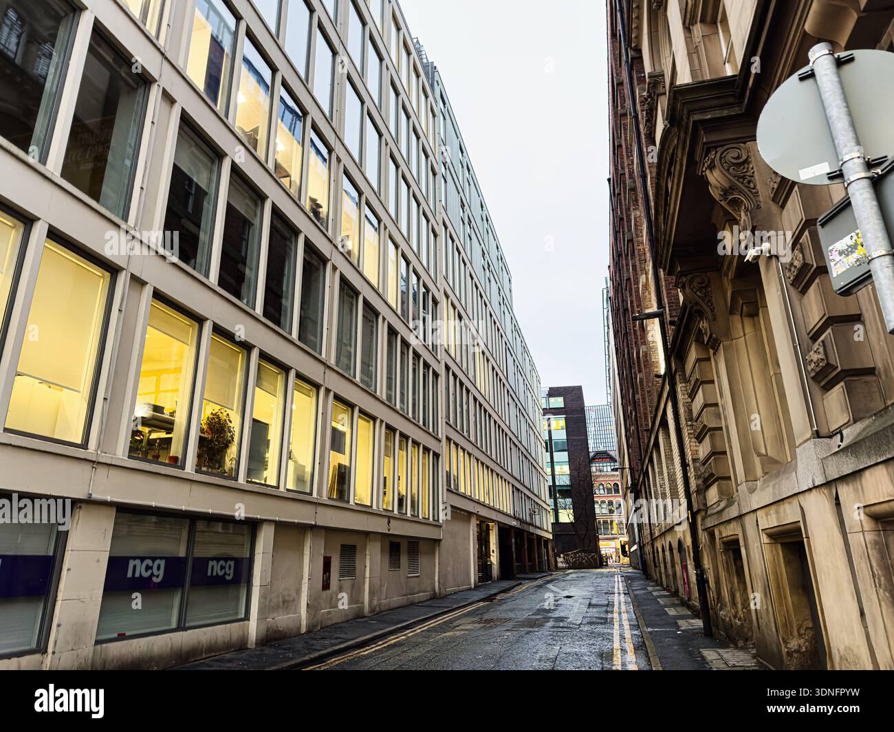 Manchester, UK - January 22, 2026: A narrow alley between a glass ...