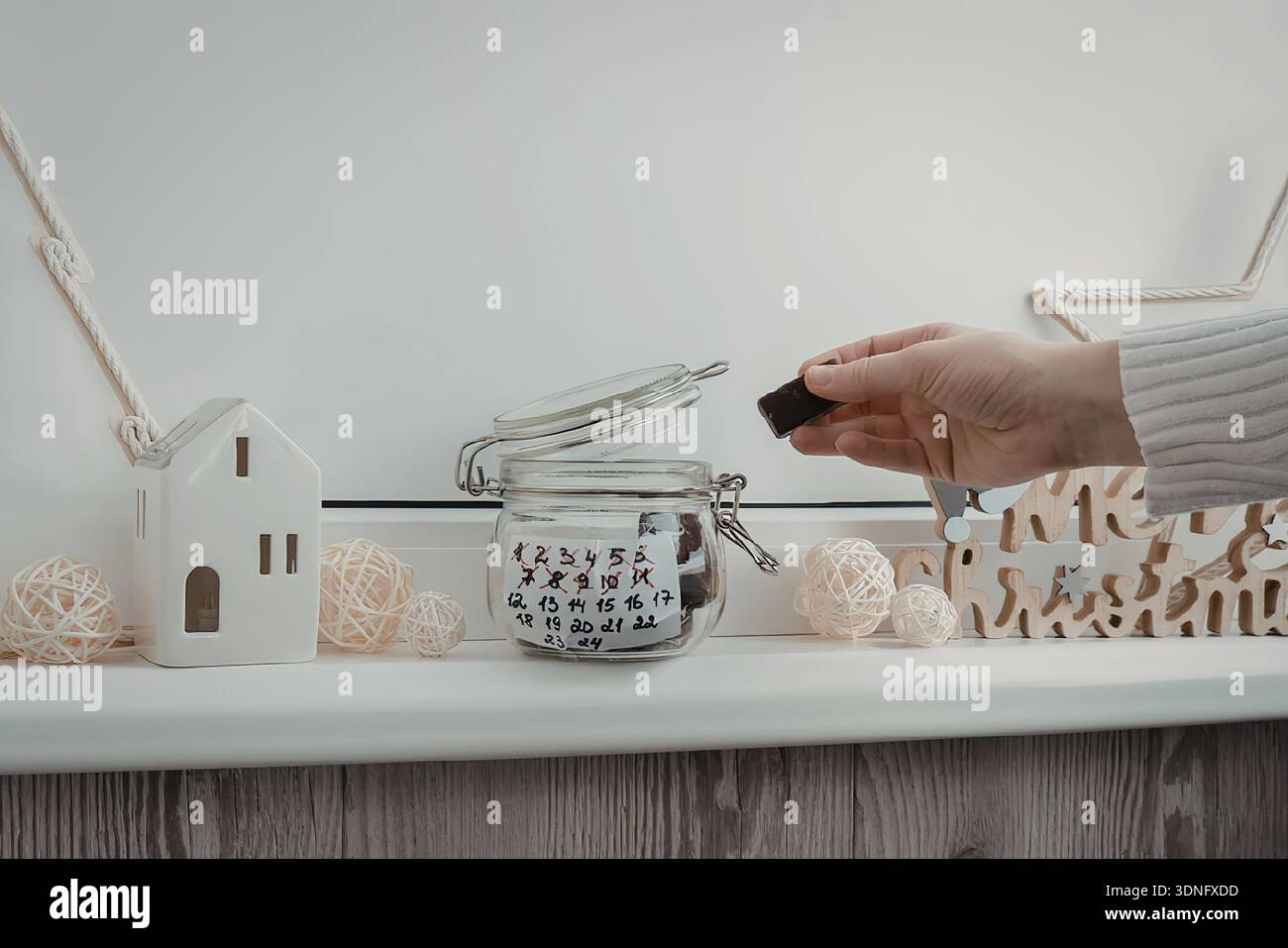 Hand placing small object hi-res stock photography and images - Alamy
