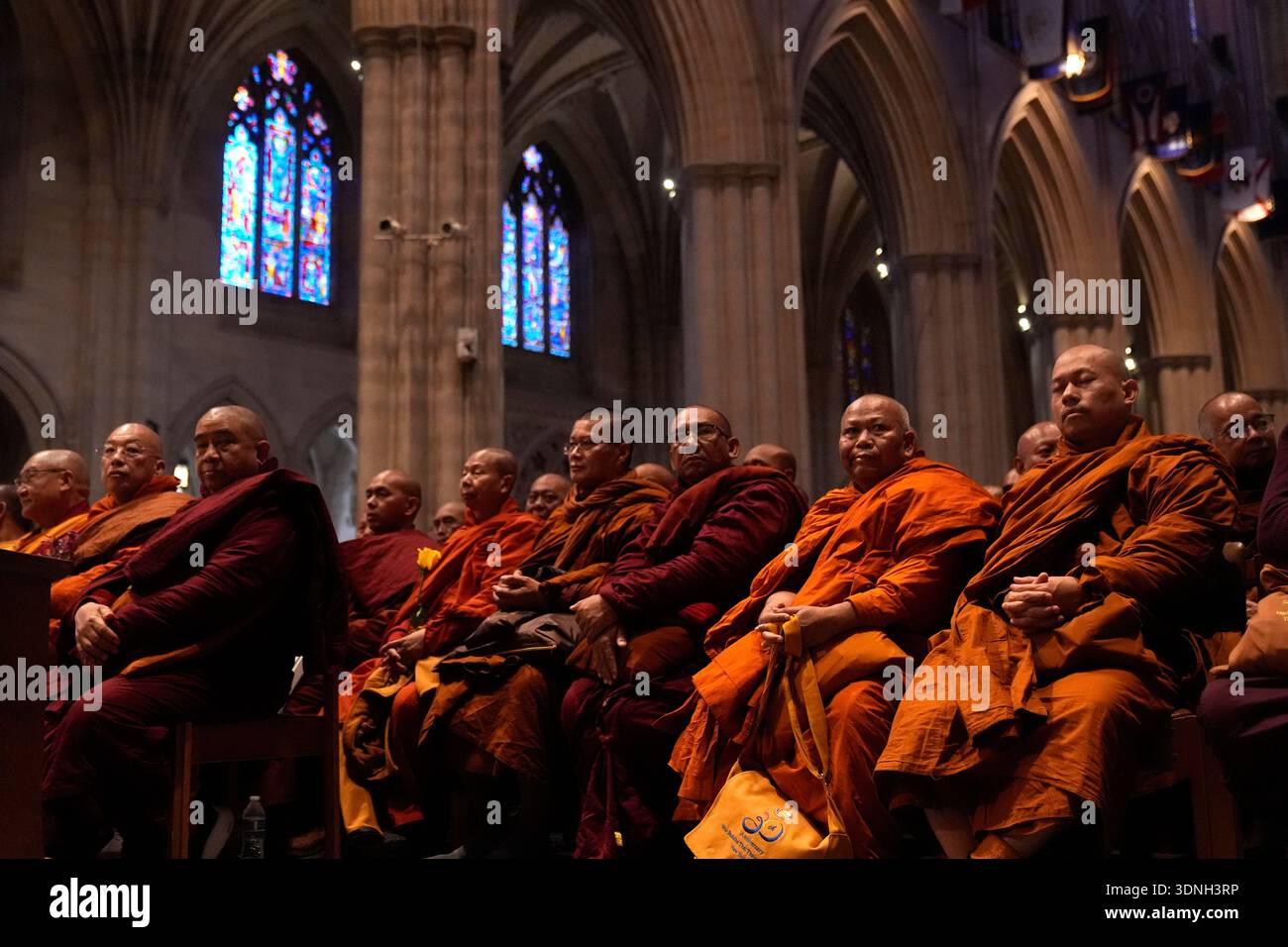 Buddhist monks sit in Washington National Cathedral during an event ...