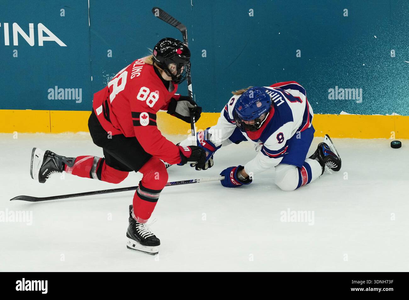 Canada's Julia Gosling, left, challenges for the puck with United ...