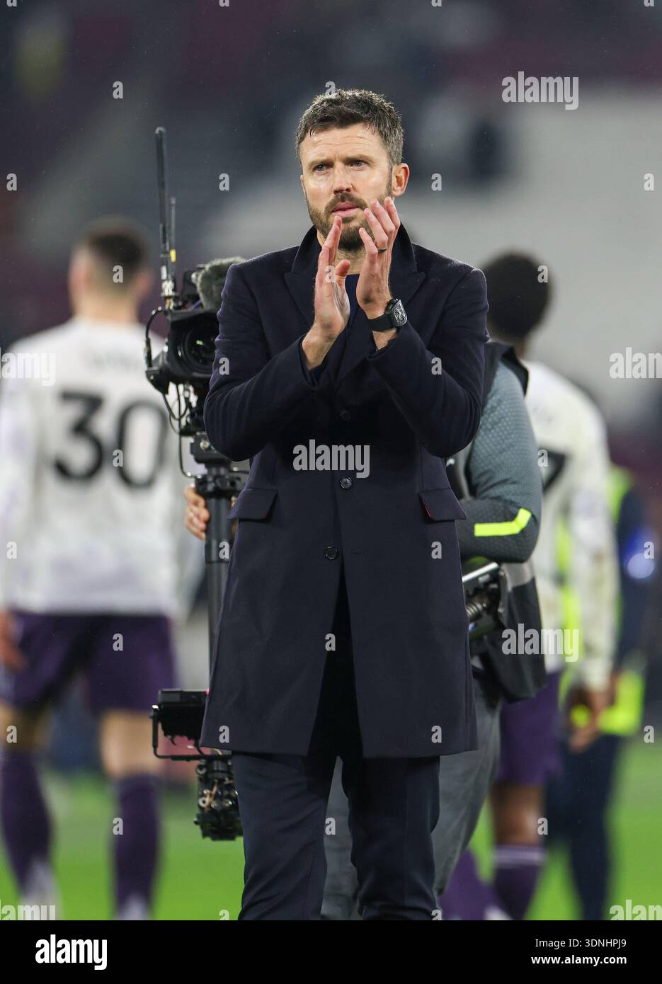 Manchester United head coach Michael Carrick applauds the fans during ...