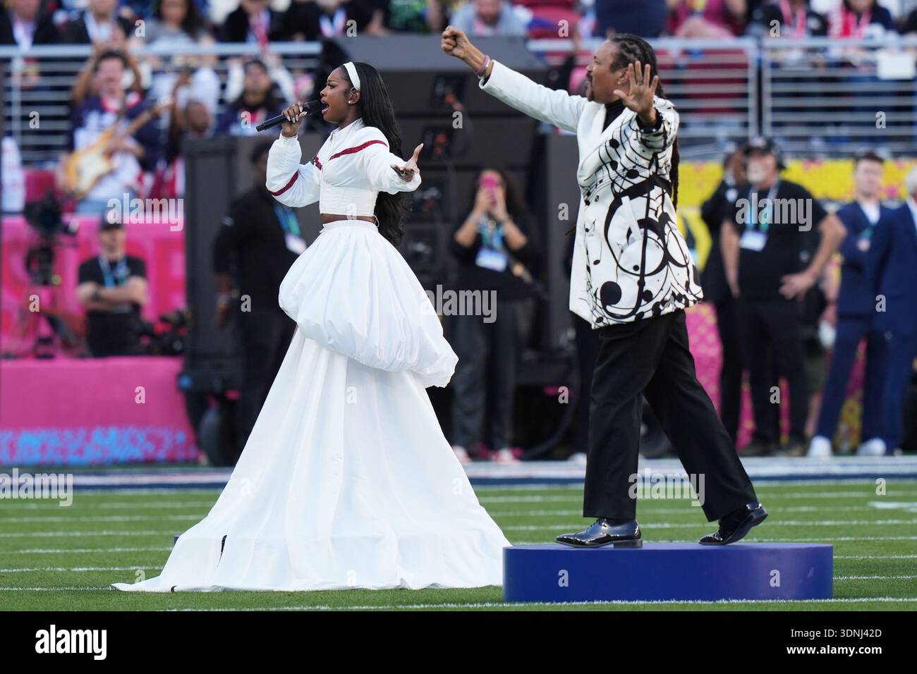Coco Jones, left, performs before the NFL Super Bowl 60 football game ...