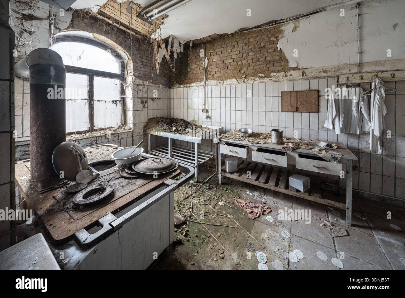Dilapidated kitchen full of rubble in an abandoned country inn, Lost ...