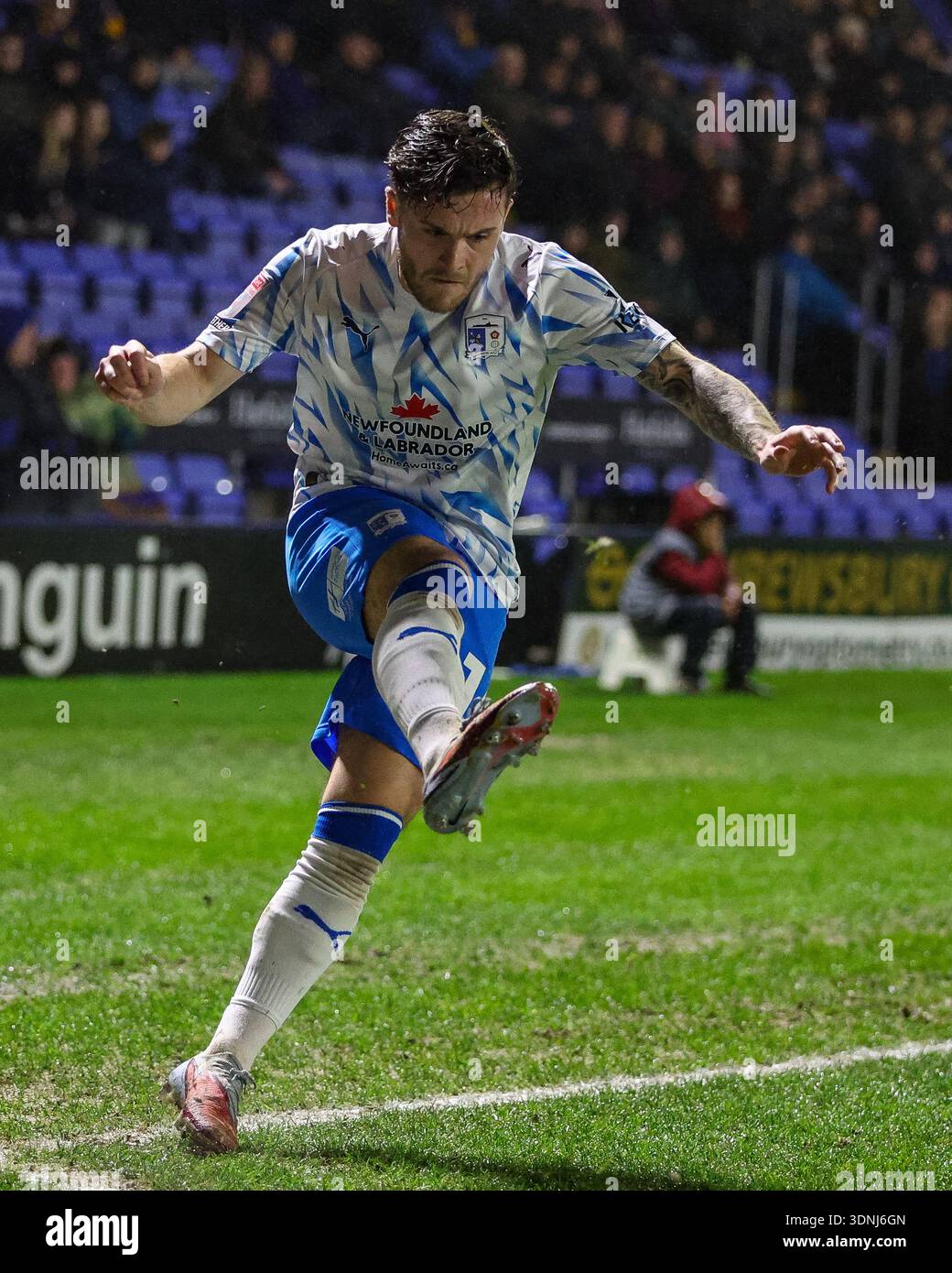 Charlie McCann in action taking a corner during the Sky Bet League 2 ...