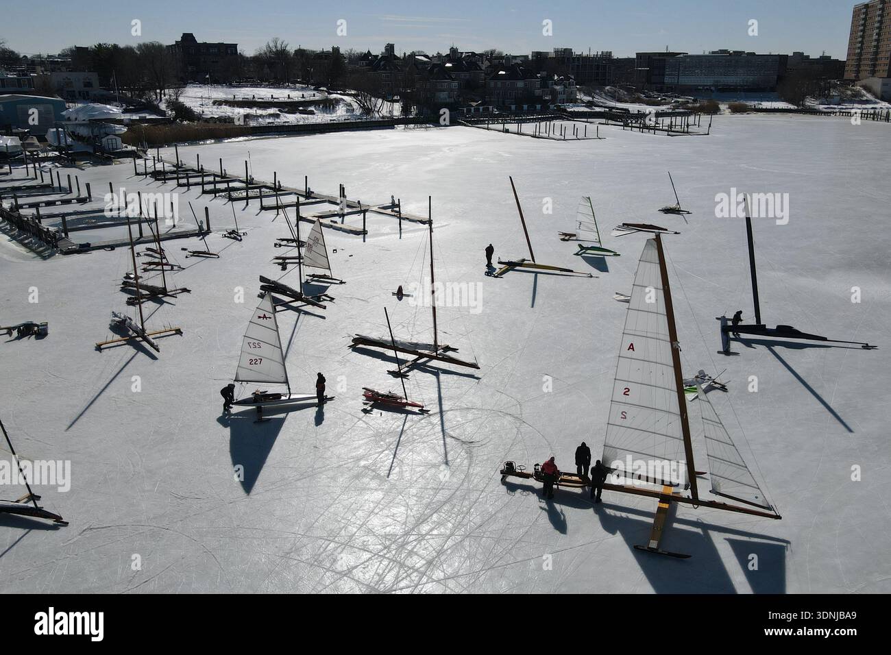 Iceboaters sail on the frozen Navesink River, an Atlantic Ocean tidal ...