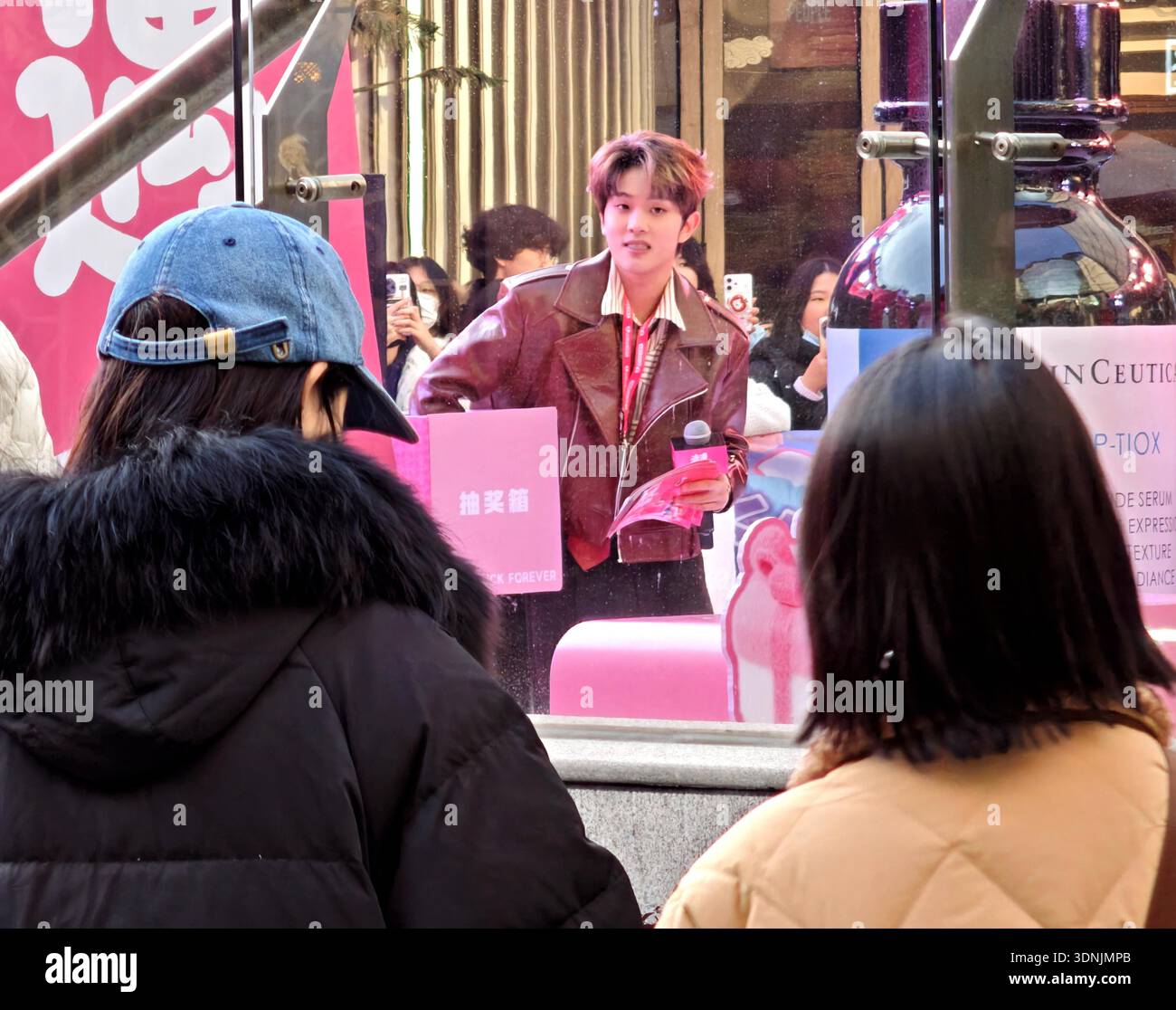 Chinese singer Zhang Xingte interacts with fans at a brand event in ...