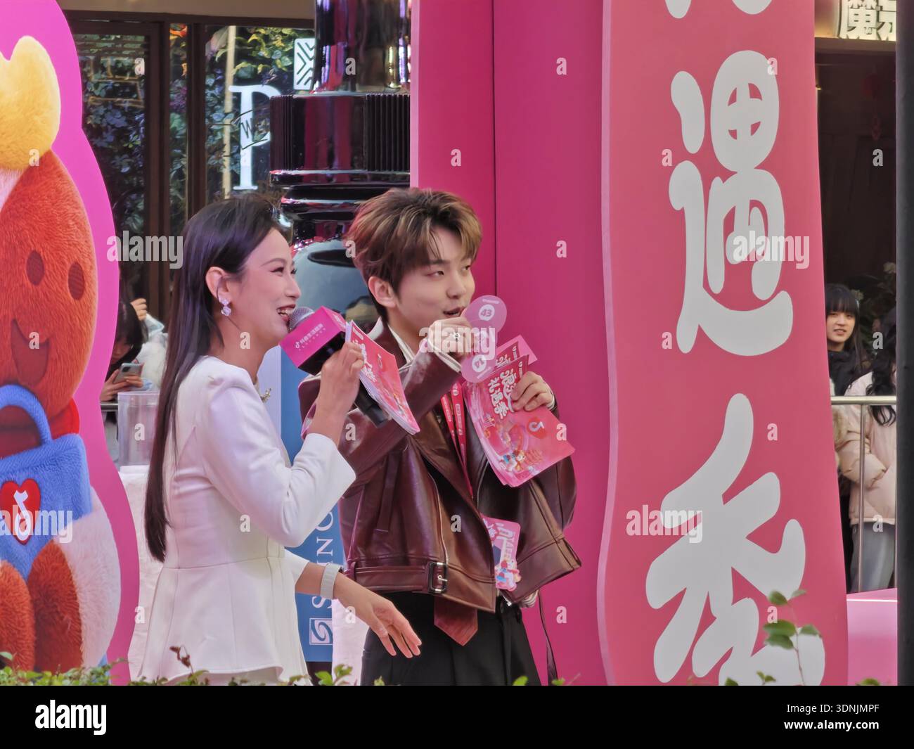 Chinese singer Zhang Xingte interacts with fans at a brand event in ...