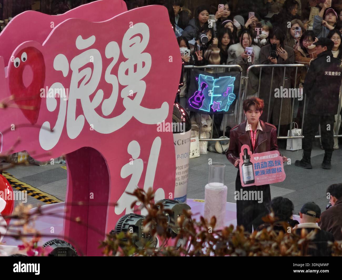 Chinese singer Zhang Xingte interacts with fans at a brand event in ...