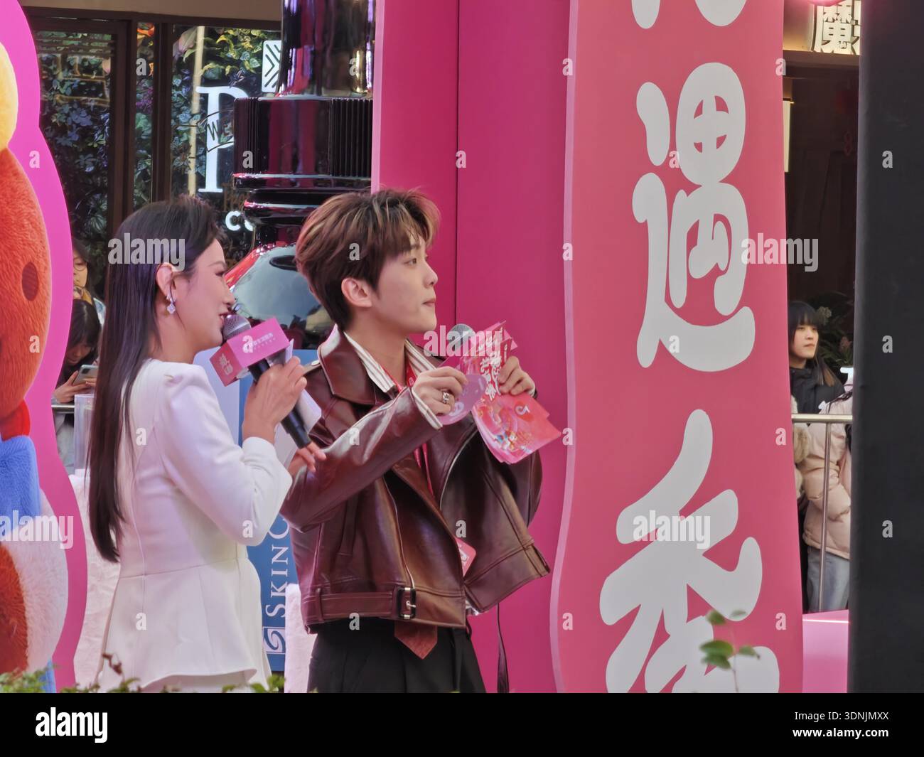 Chinese singer Zhang Xingte interacts with fans at a brand event in ...