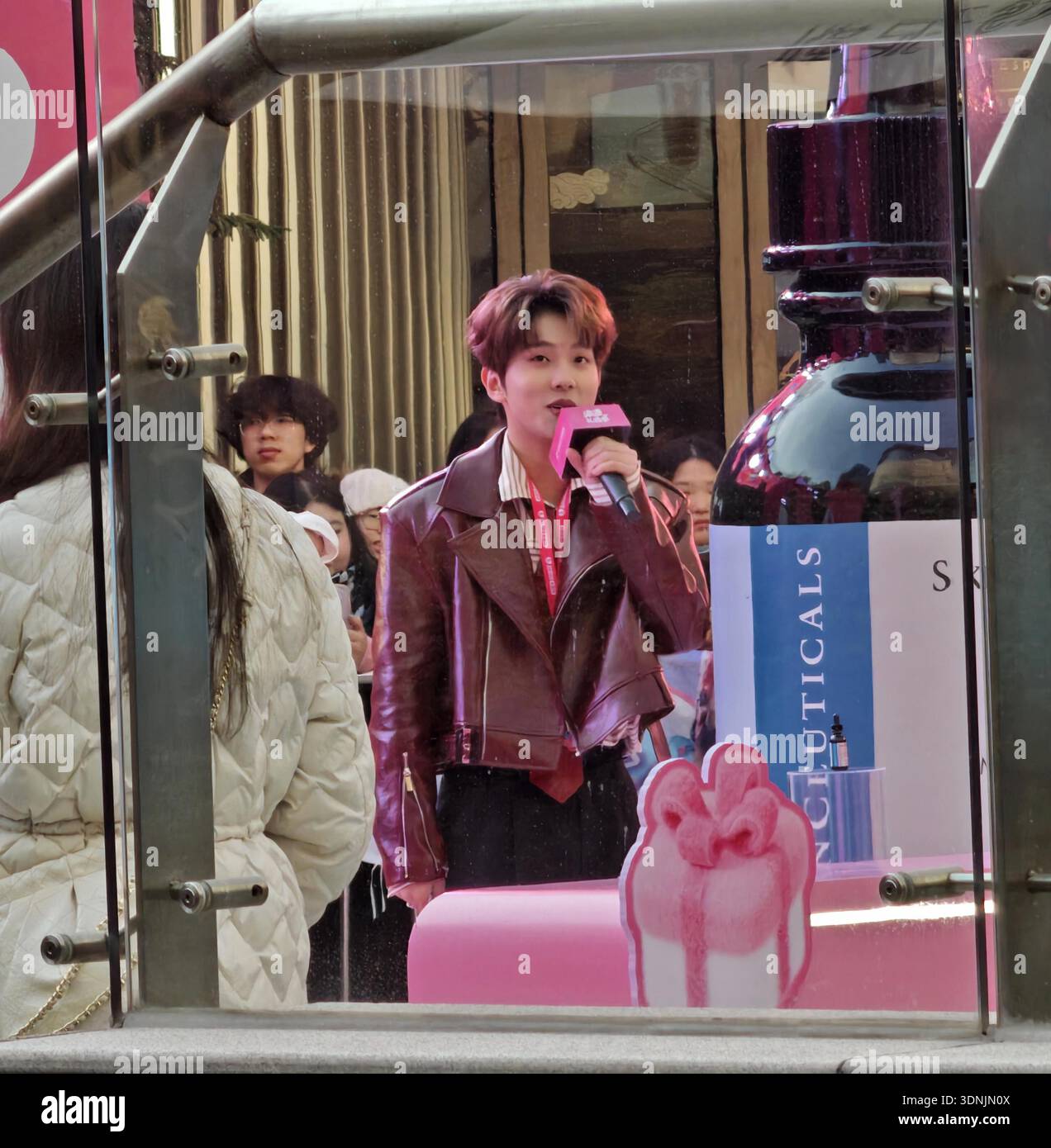 Chinese singer Zhang Xingte interacts with fans at a brand event in ...