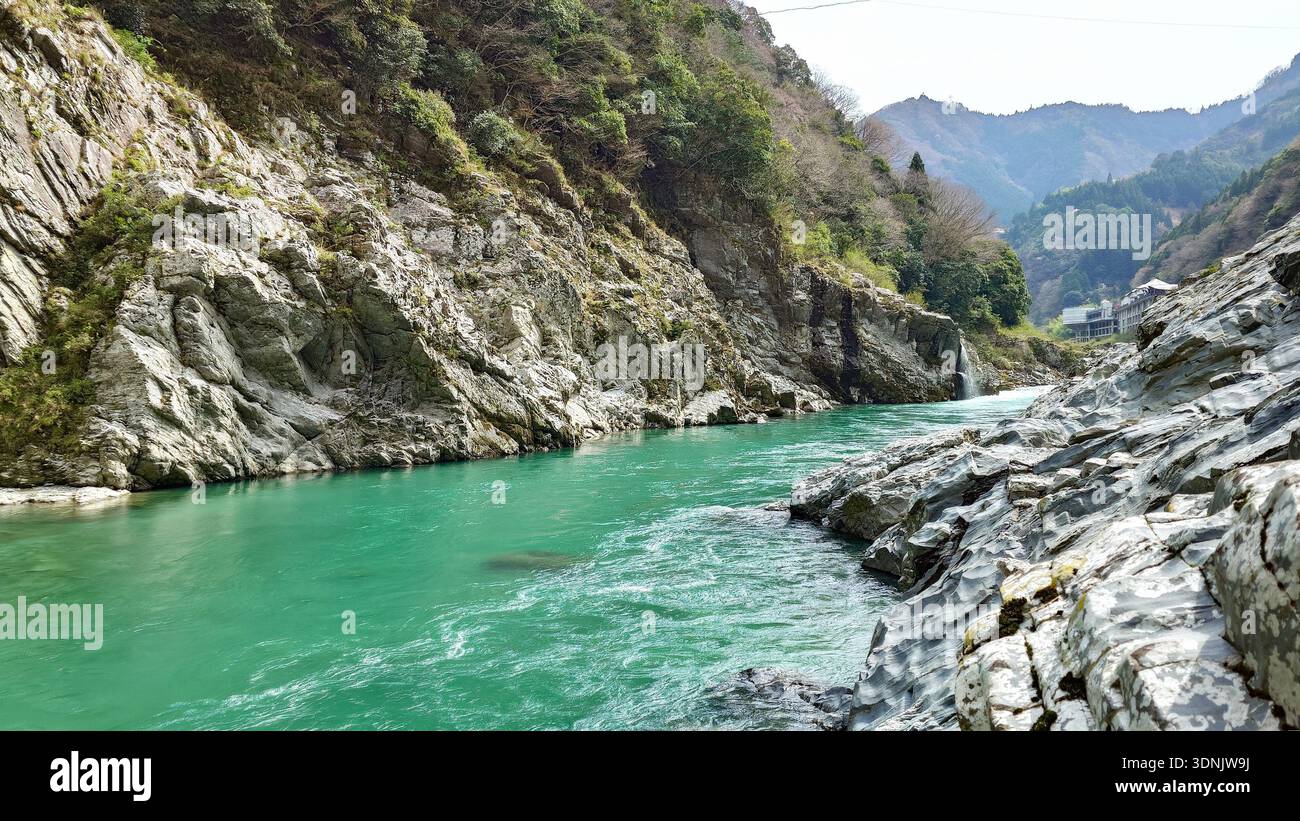 Emerald green Yoshino River flows through the jagged crystalline schist ...