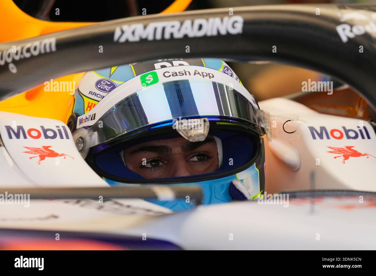 Racing Bulls driver Arvind Lindbald of Britain waits in his car during ...