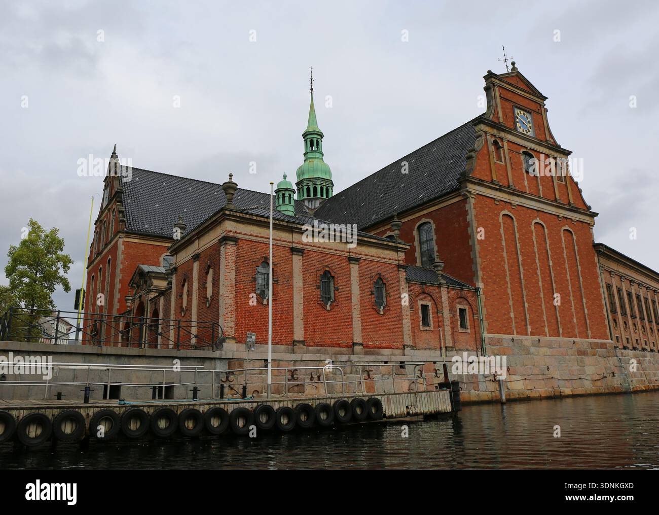 The Holmen Church with green tower and Clock by The Canal in Copenhagen ...