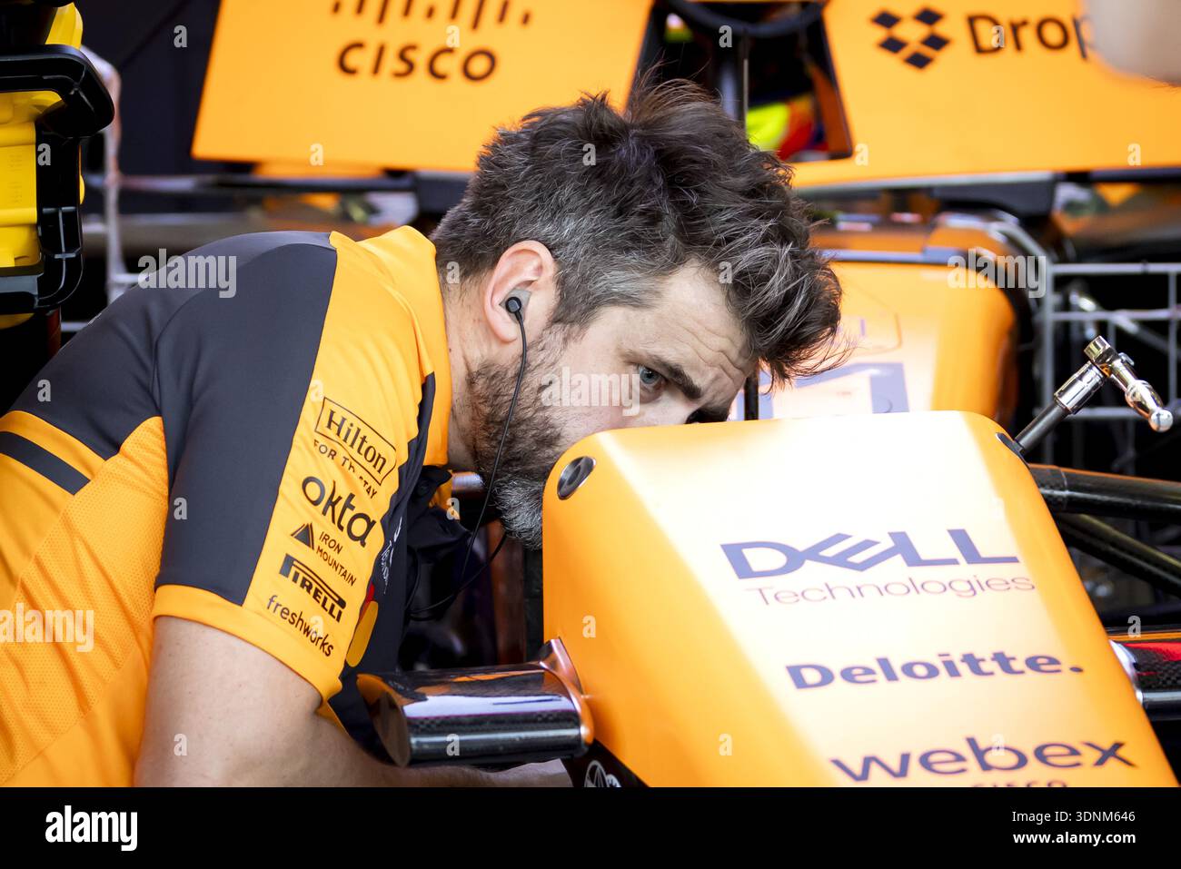 BAHRAIN - A McLaren mechanic working on Oscar Piastri's (McLaren) front ...