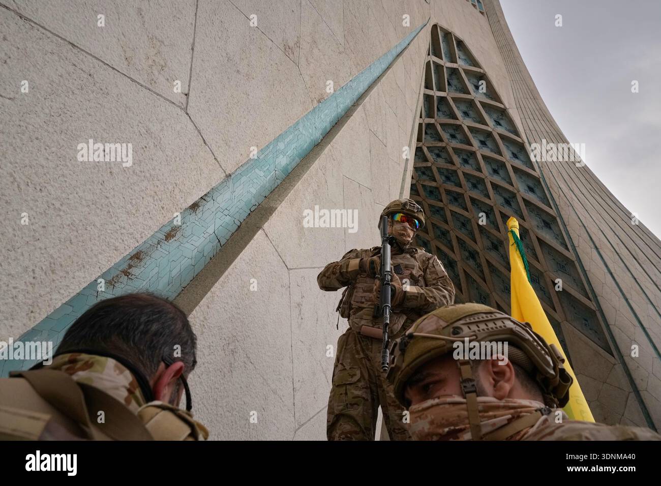 Members of Iran's Revolutionary Guard stand guard near the Azadi ...