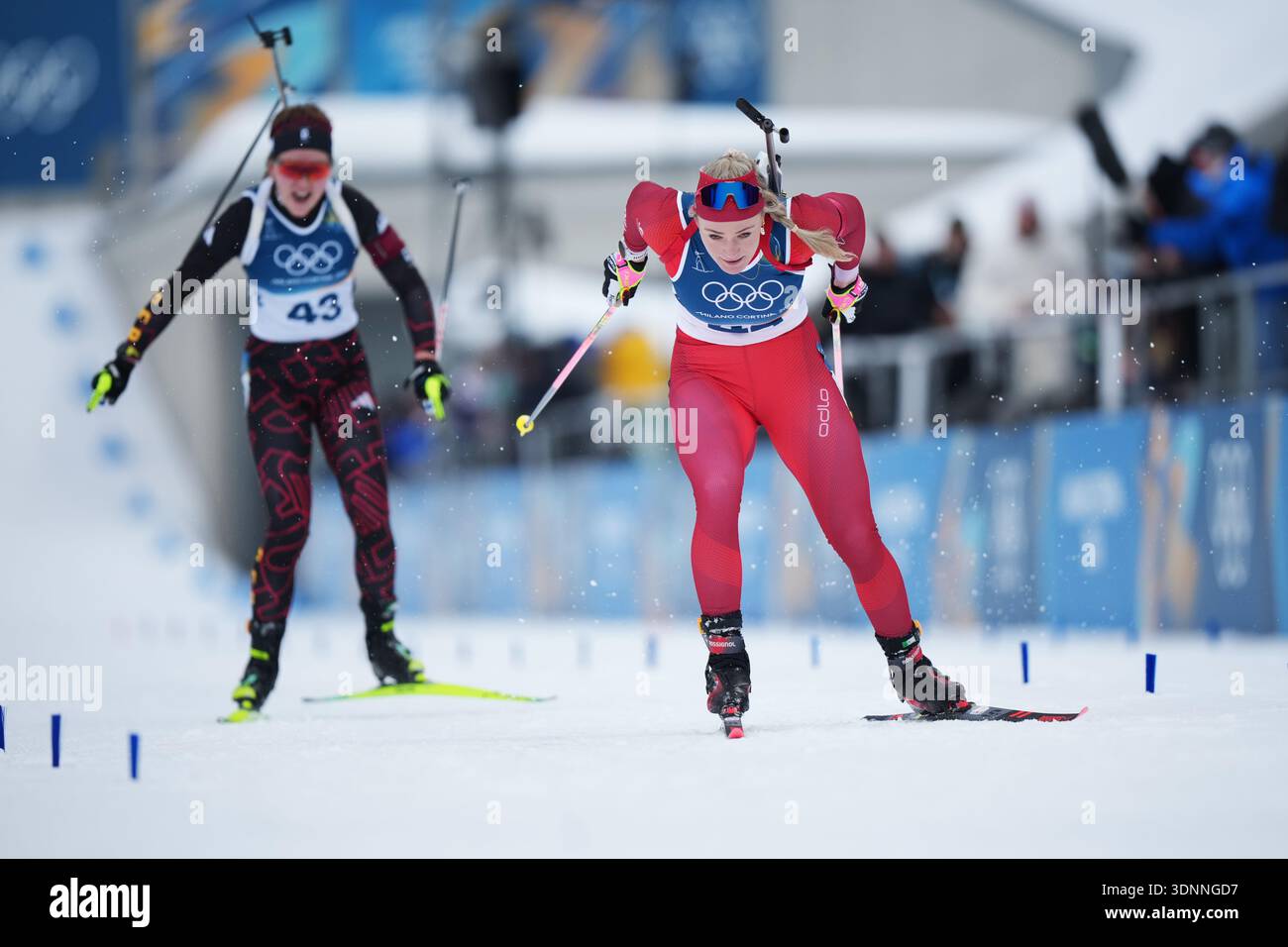 Amy Baserga, of Switzerland, right, skis to the finish line for the ...