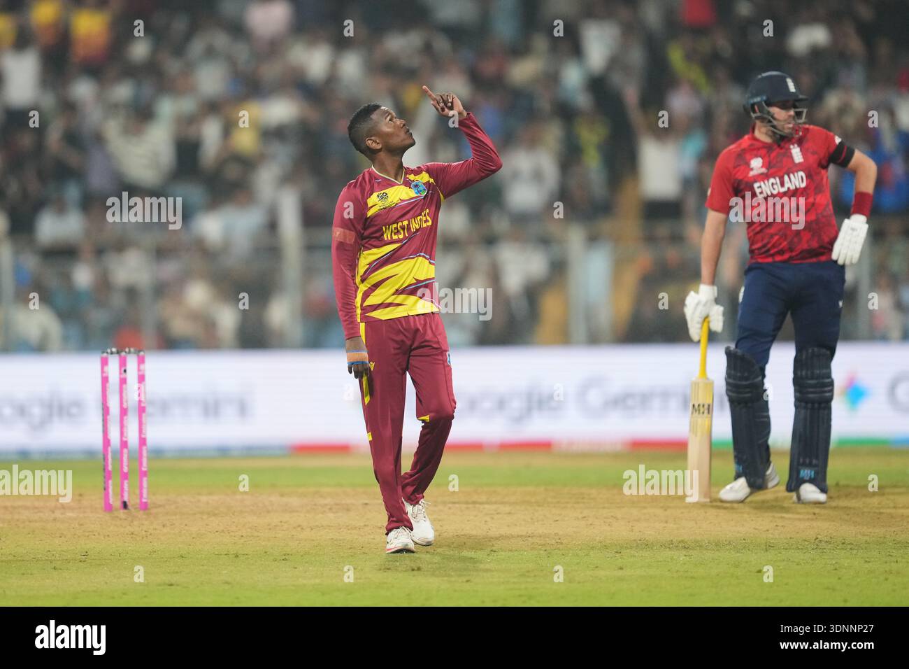 West Indies' Akeal Hosein celebrates the wicket of England's Jamie ...