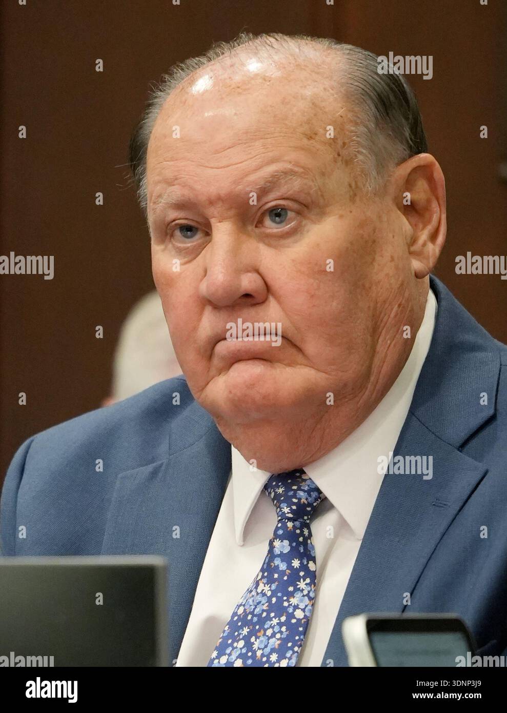 Former FirstEnergy CEO Chuck Jones listens to the testimony of witness ...