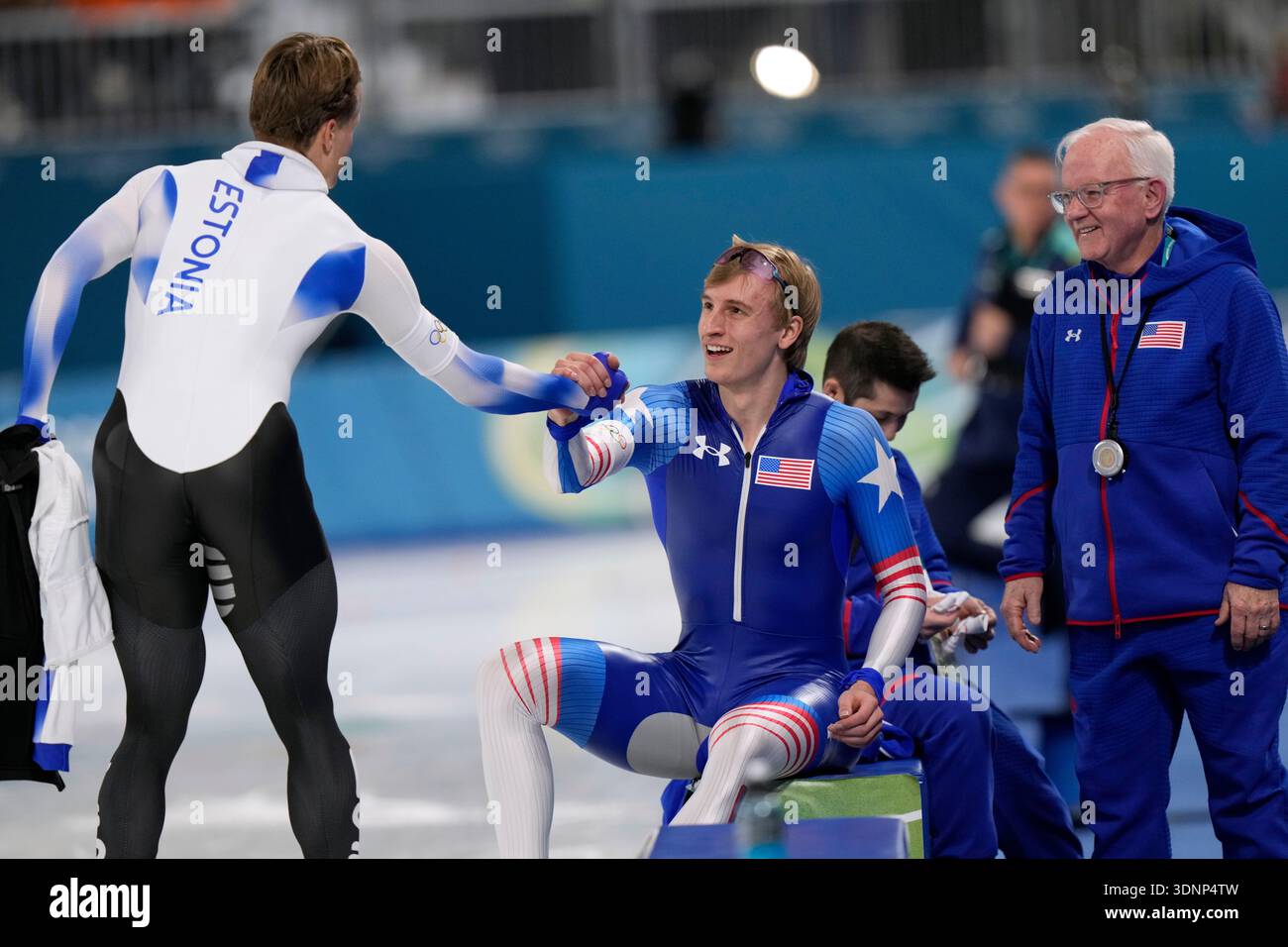 Jordan Stolz of the U.S. is congratulated by Marten Liiv of Estonia ...