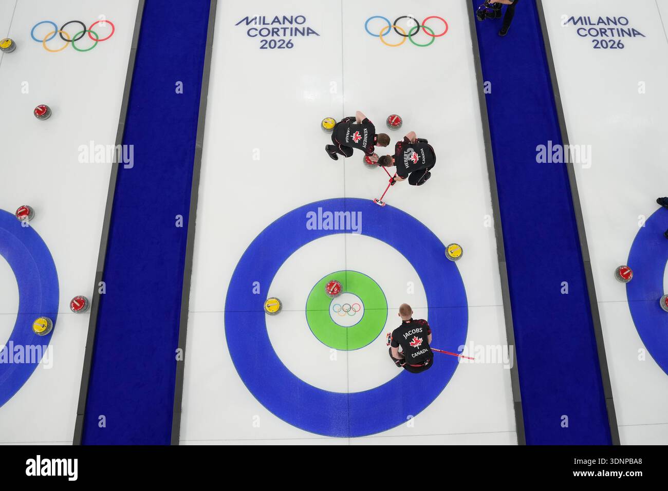 Canada's Ben Hebert, Marc Kennedy and Brad Jacobs compete during a men ...