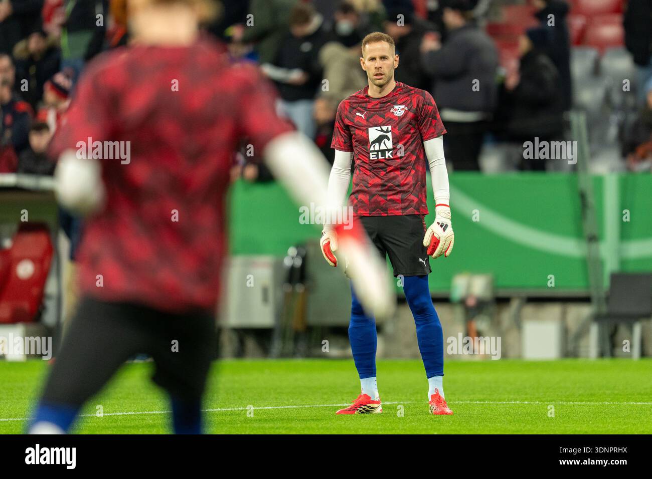 MUNICH, GERMANY - FEBRUARY 11, 2026: Péter Gulácsi of RB Leipzig warms ...