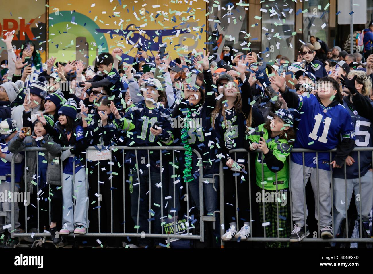 Seattle Seahawks fans look up at confetti watch during the team's NFL ...