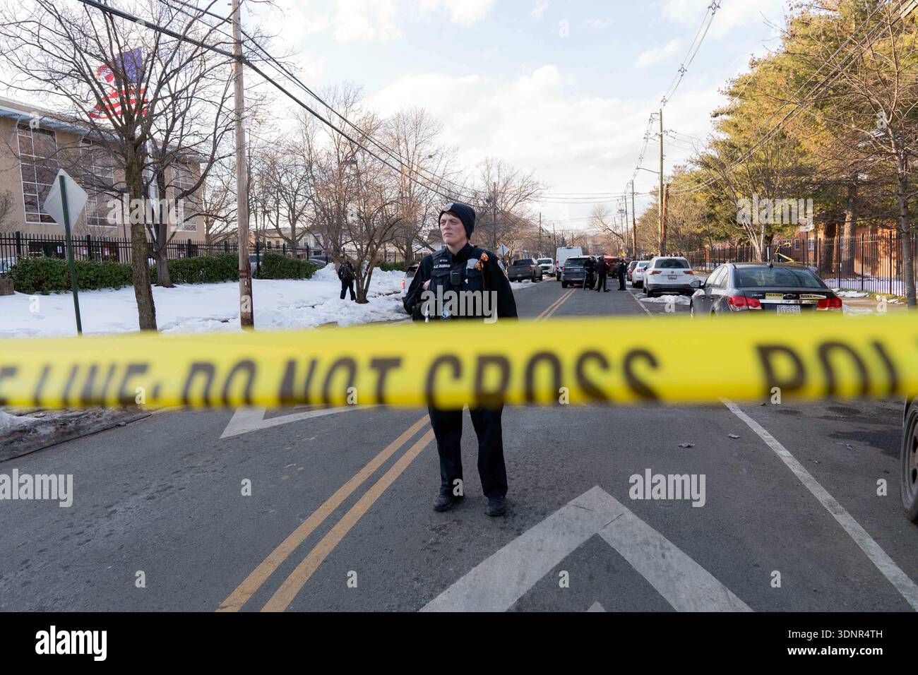 A Metropolitan police officer scans the area after a shooting at the ...