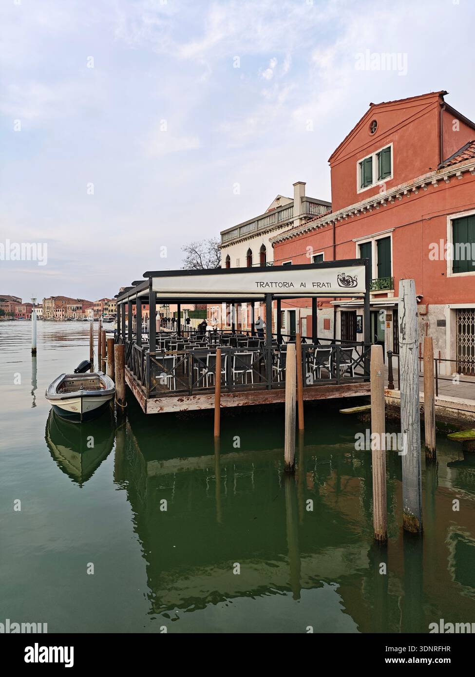 Waterside terrace of Trattoria Ai Frati restaurant in Murano, Venice ...