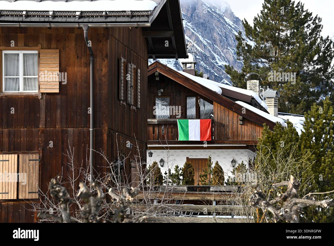 An Italian flag hangs off the balcony of a chalet in the town of ...