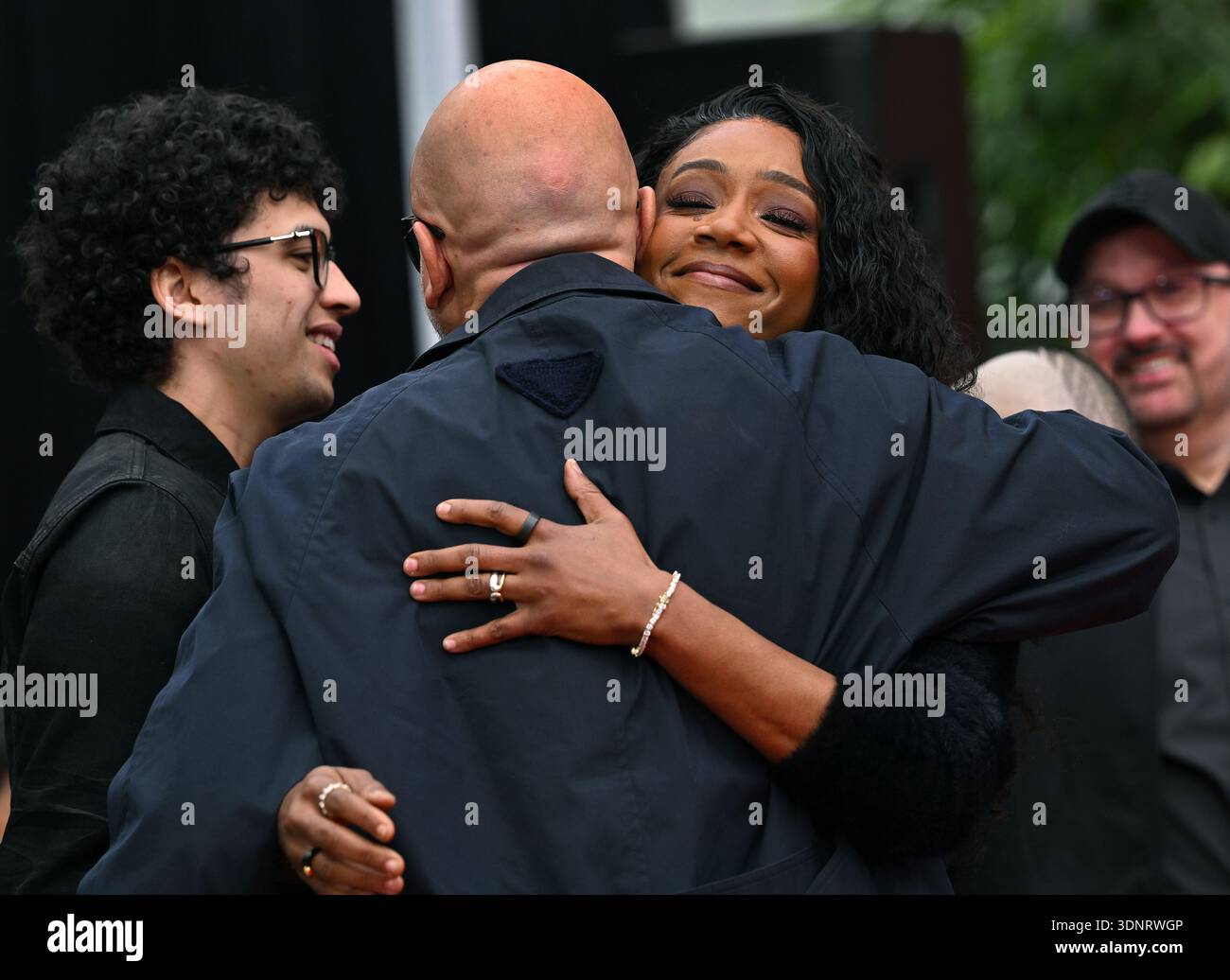 Tiffany Haddish hugs Jo Koy as they attend a hand and footprint ...