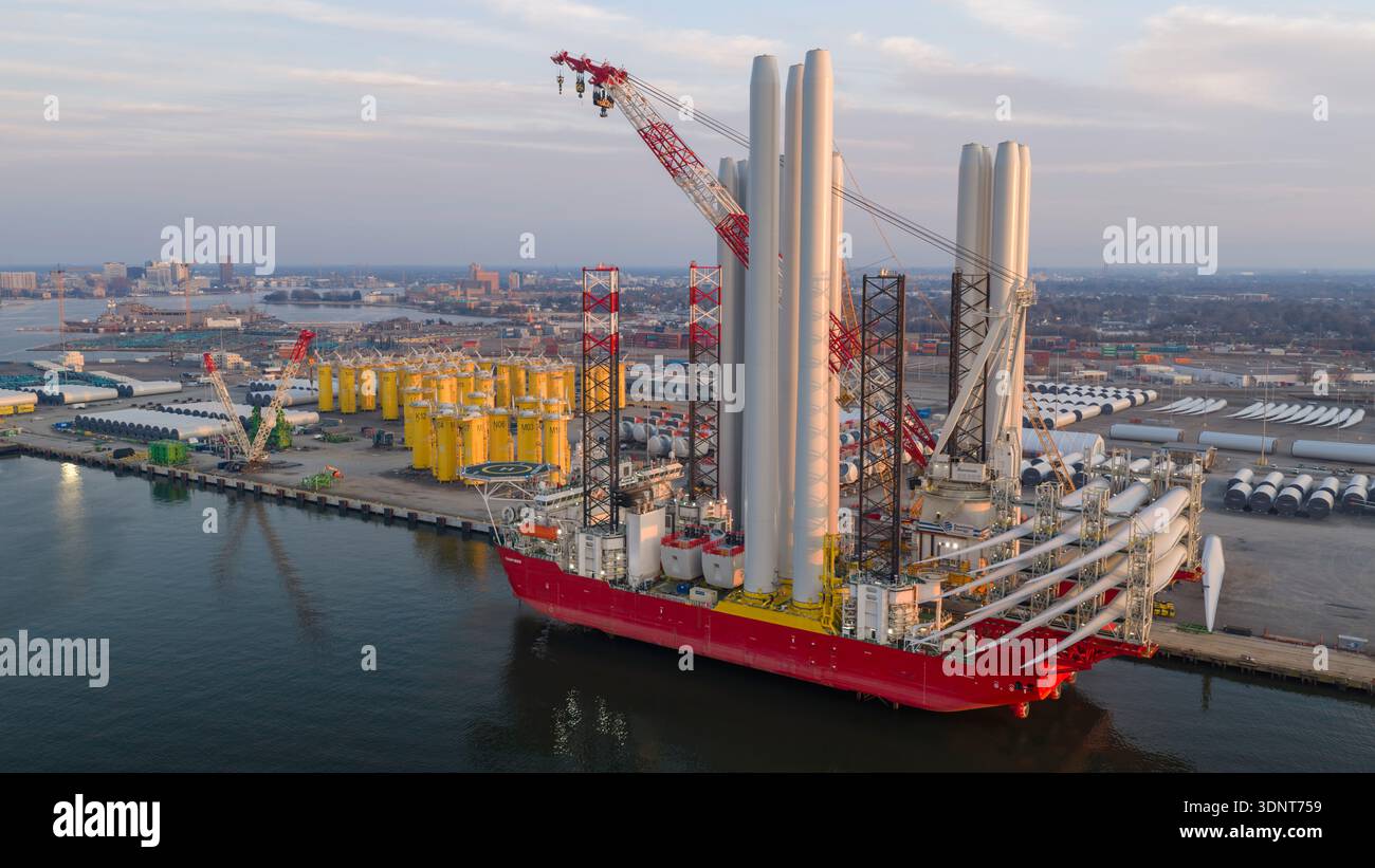 A construction barge is loaded pier side at the Dominion Energy ...