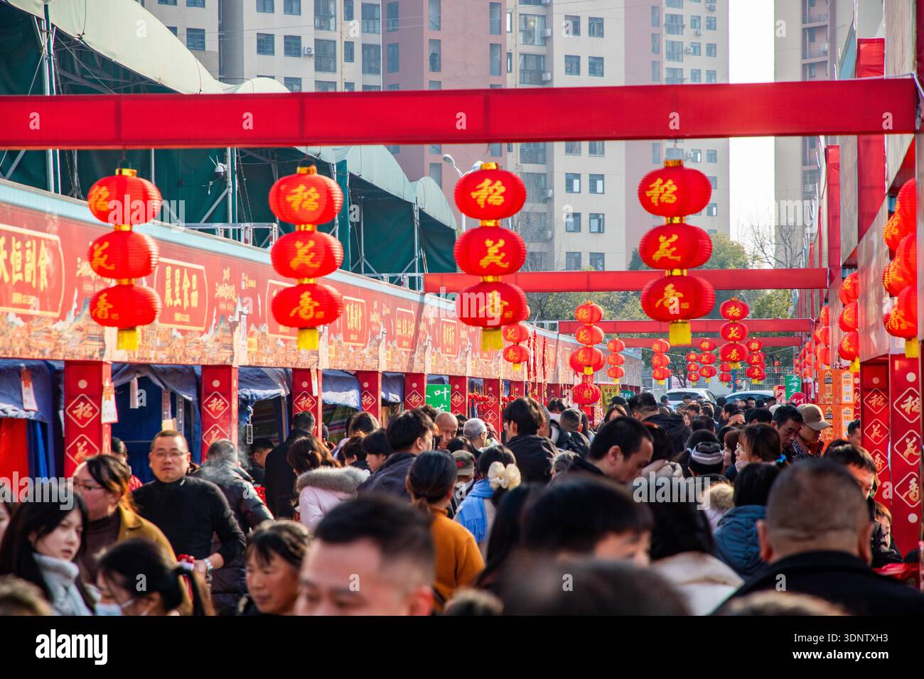 Residents select New Year goods at a bustling market in Three Gorges ...