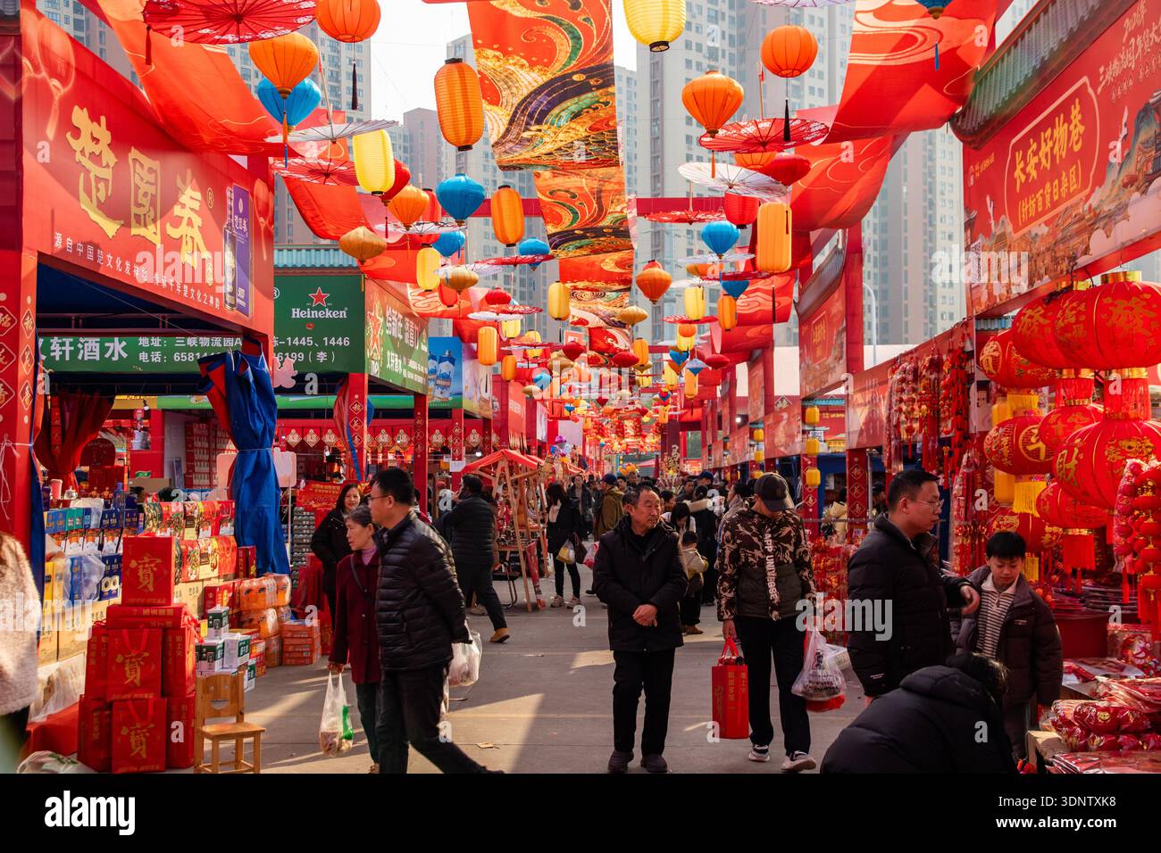 Residents select New Year goods at a bustling market in Three Gorges ...