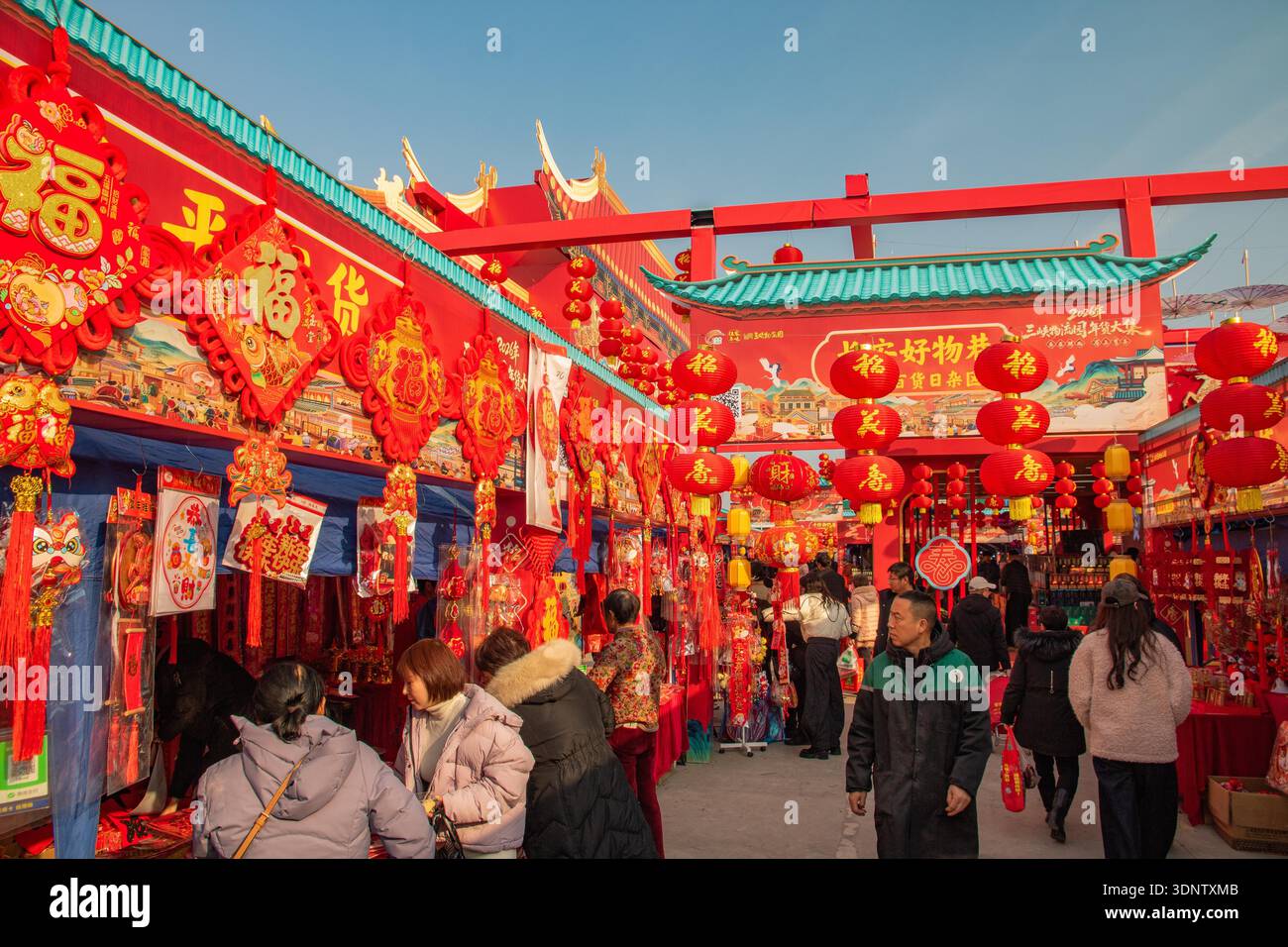 Residents select New Year goods at a bustling market in Three Gorges ...
