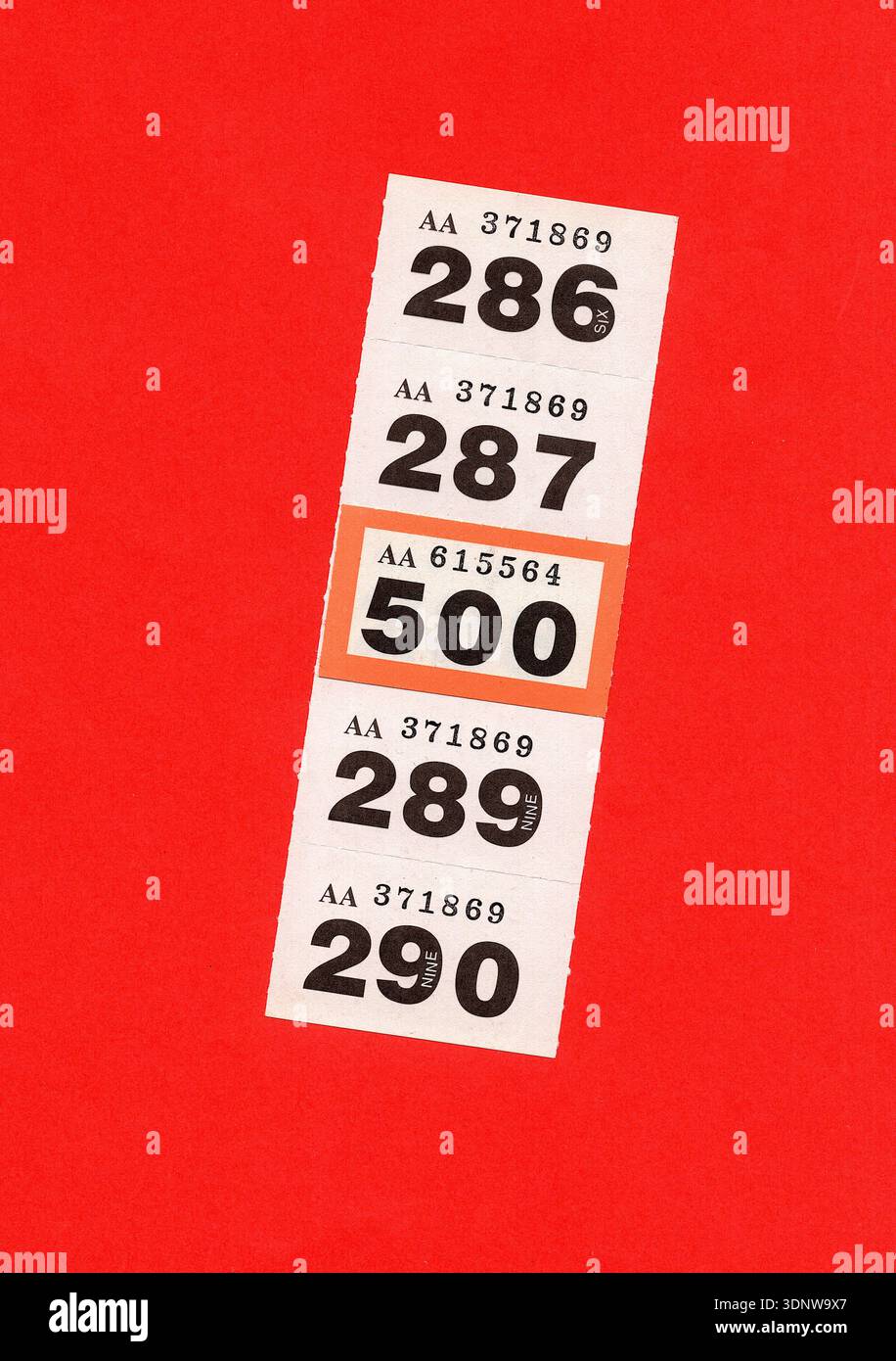Vintage raffle tickets with one in a different colour isolated on a ...