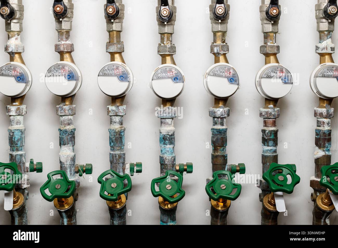 Lot of cool water consumption meters for each apartment on pipeline ...